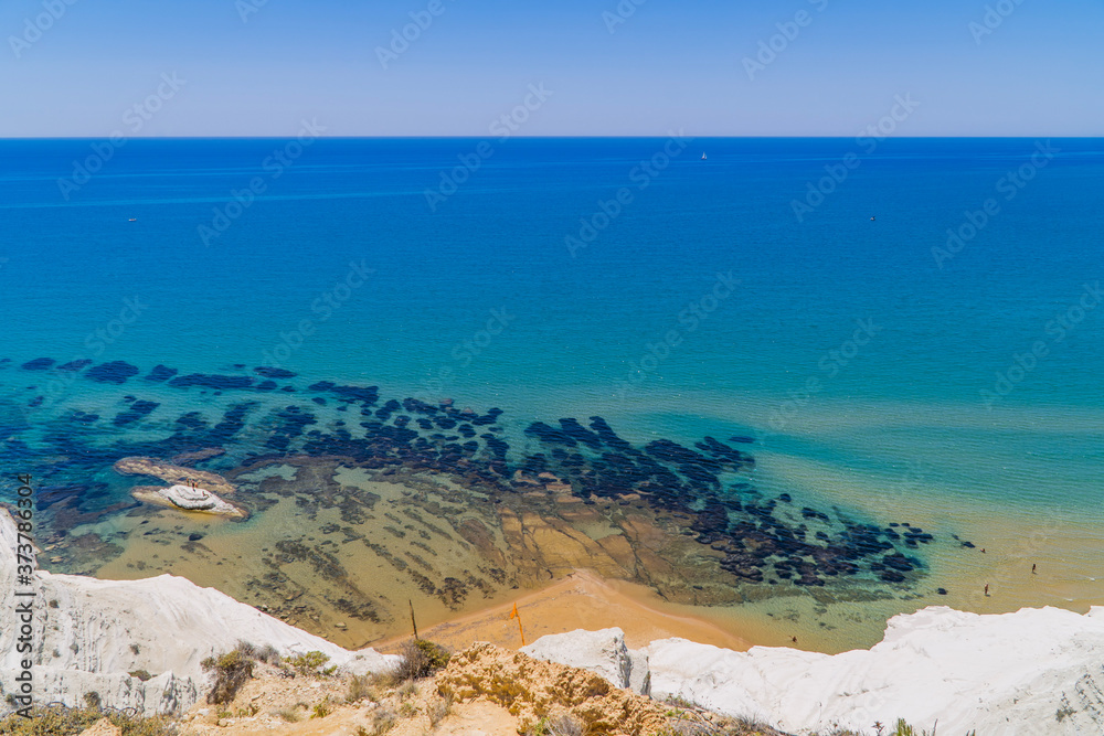 Beaches with white limestone cliffs and different shades of blue seas ...