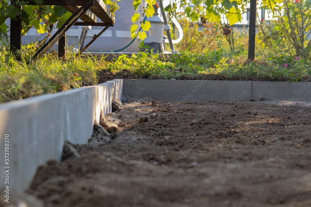 Installation of the Curb before laying paving slabs. Reconstruction of ...