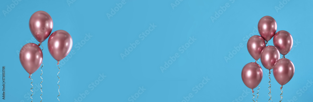 Pink balloons on light blue background, space for text. Banner design ...