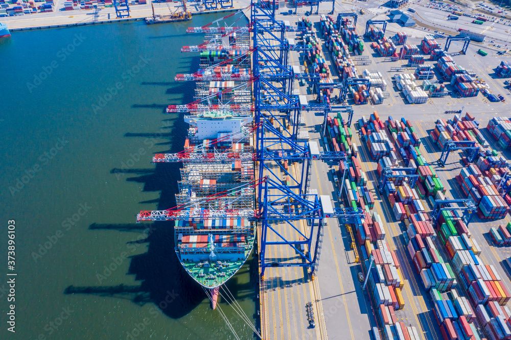 Container ship loading at port with crane, container ship carrying ...
