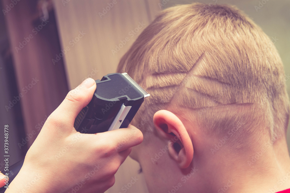Haircut drawing on the boy's head in the form of a spider's web. Stock ...