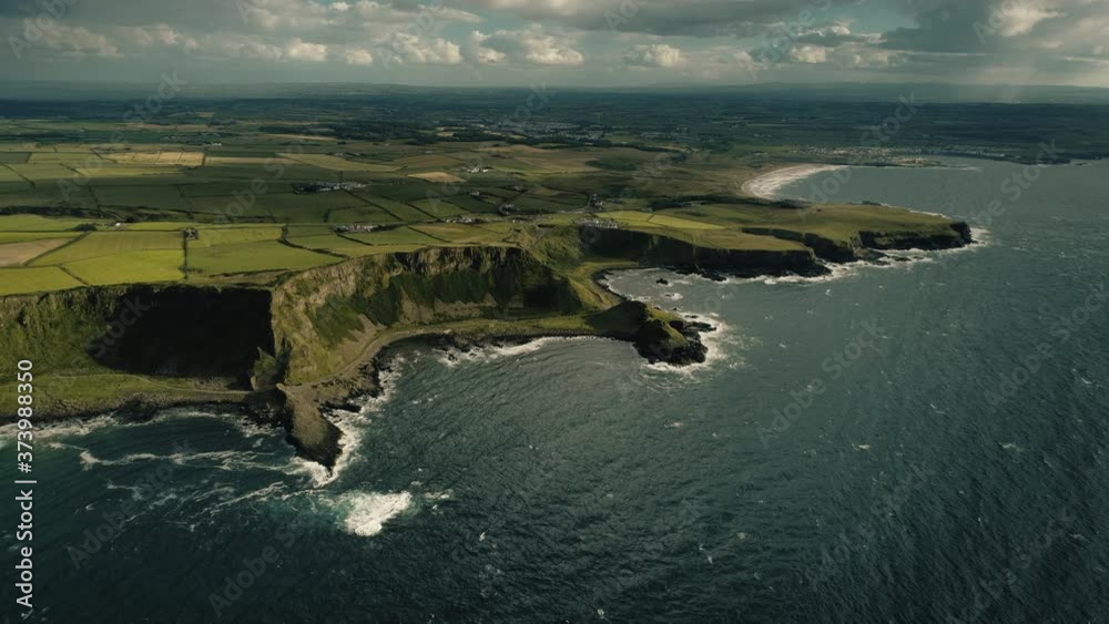 Ireland sea bay coastline aerial view: autumn greenery farmlands with ...