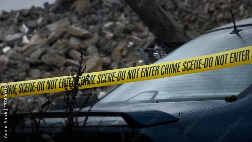 Video Stock Police Crime Scene Cordon Tape Around Junkyard Car. There ...