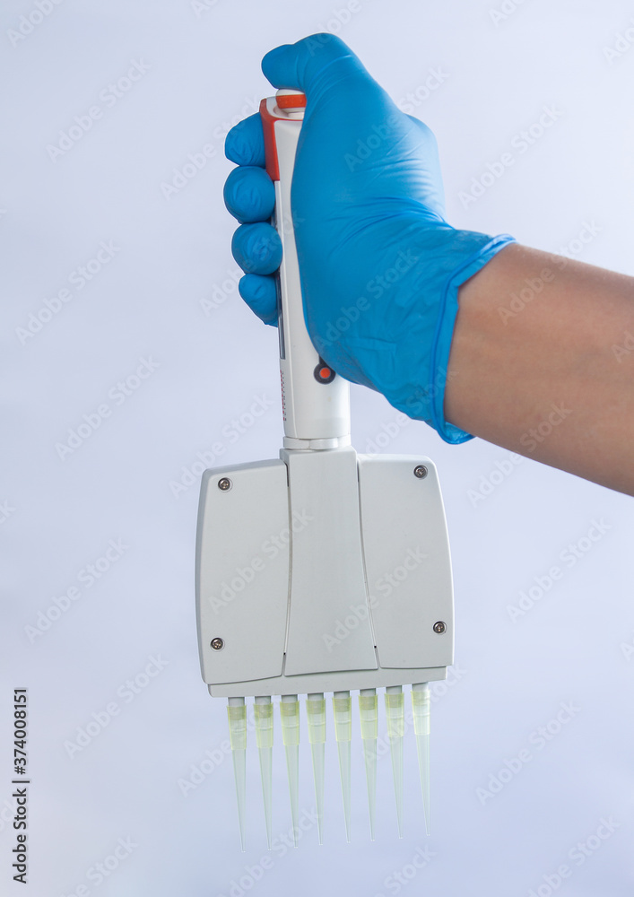 Hand in glove with automatic multichannel pipette for pcr analysis of ...