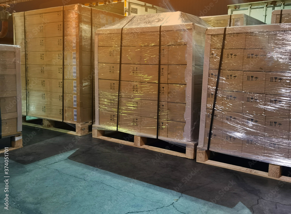 Shipment cartons box on wooden pallets in interior warehouse cargo ...