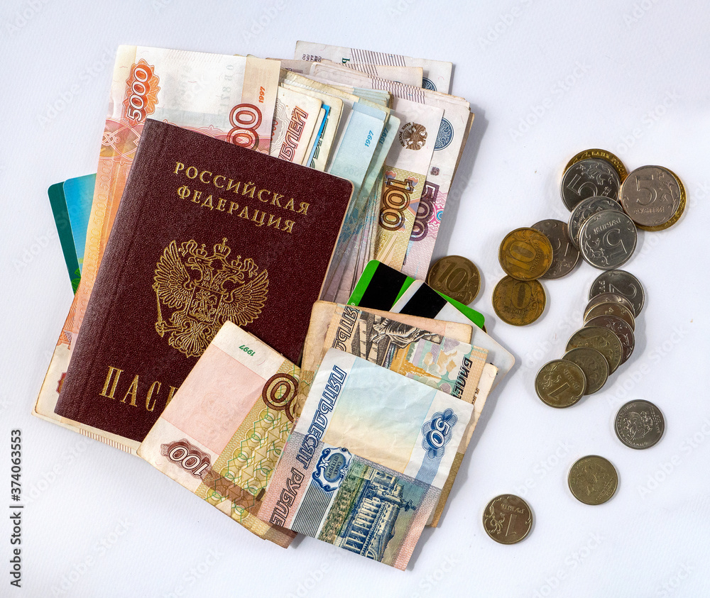 Russian paper money and ruble coins, as well as plastic cards and the ...