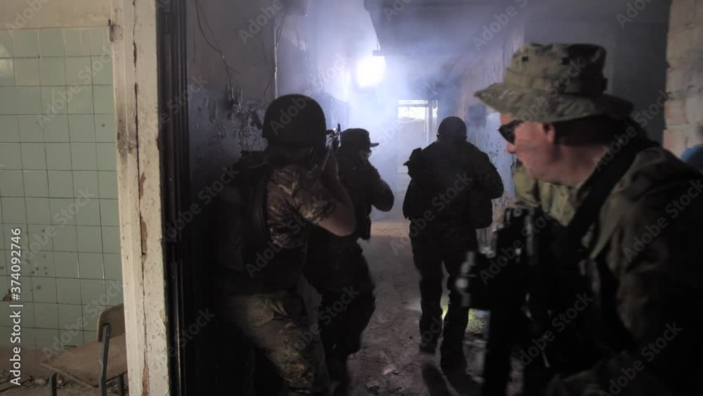 Video Stock Armed fighters following the chain through narrow smoky ...