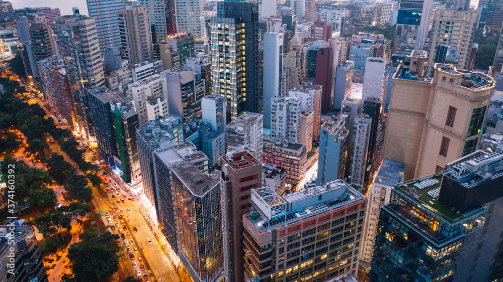 Aerial top view of downtown district buildings in night city light ...