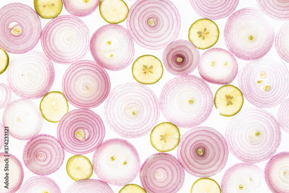 Onions and lemons background. Sliced onion and lemons. Backlit ...