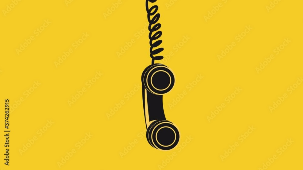 Handset abandoned of an old telephone hanging and swinging against a ...