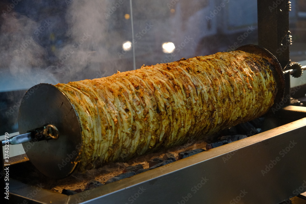 Preparation of chicken shawarma. chicken stack on slowly-turning ...