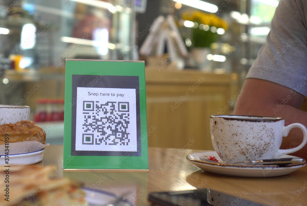 QR code touch-free payment display in the retail store. To use a QR ...