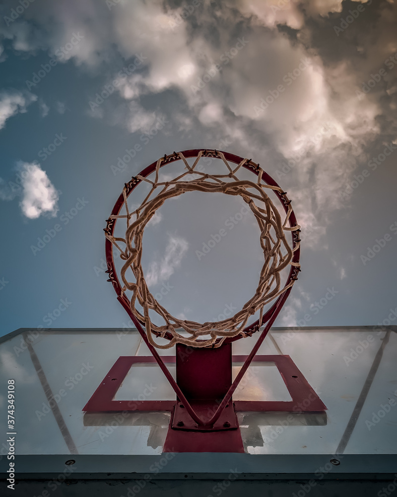 basketball under beautiful summer sunlight with clouds background Stock ...