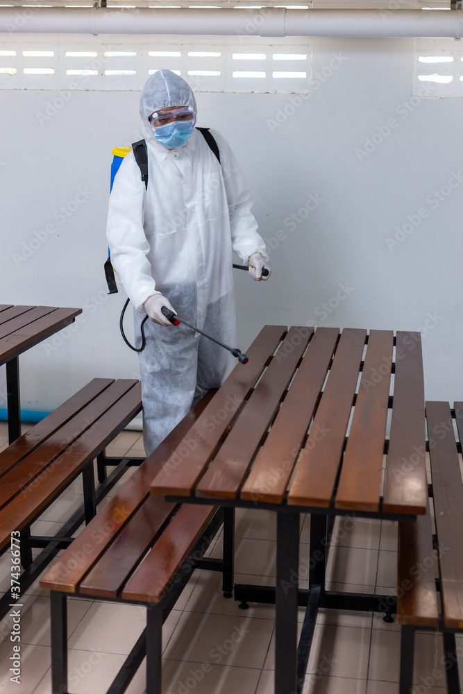 Male medical staff wearing PPE suits to protect against COVID-19 using ...