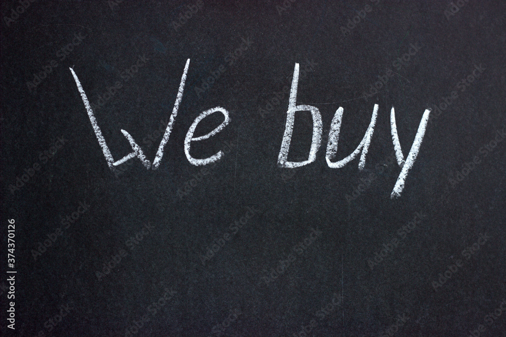 The inscription on the chalkboard "We buy". A common phrase in business ...