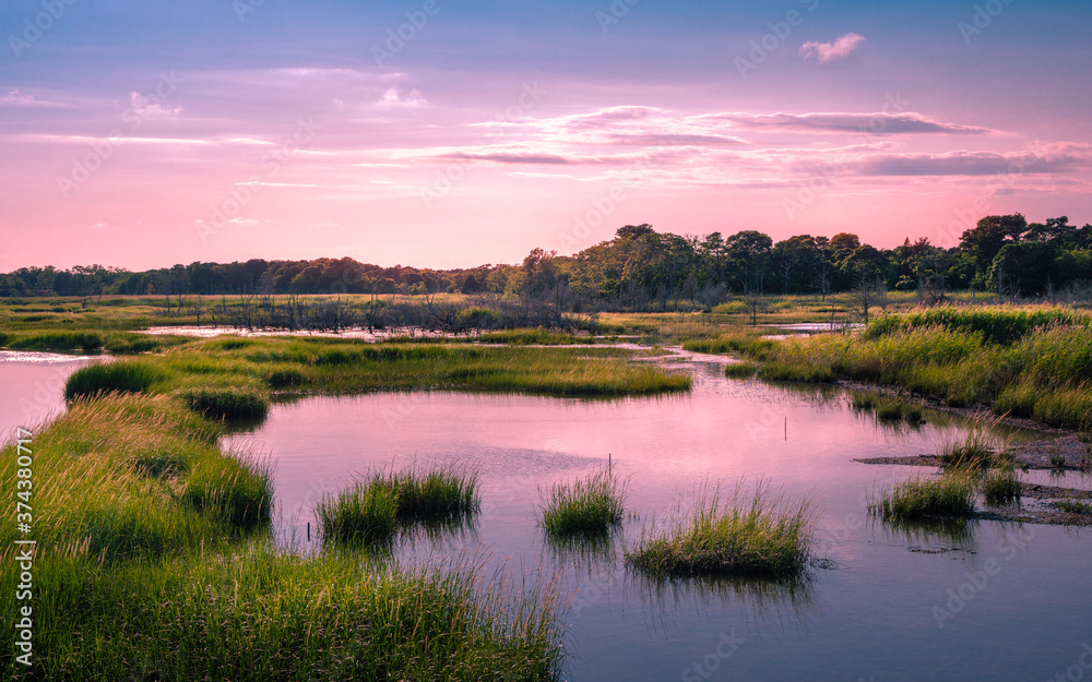 Twilight cloudscape over the flooded marsh at high tide on Cape Cod ...