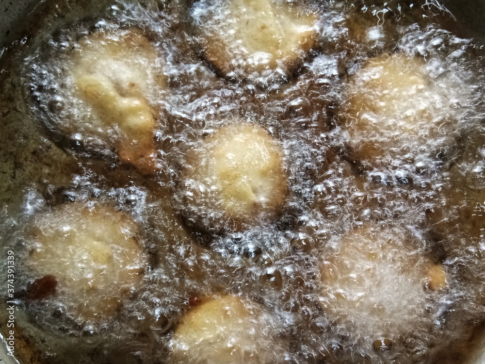 Kerala traditional style soft puffy sweet unni appam placed in a steel ...