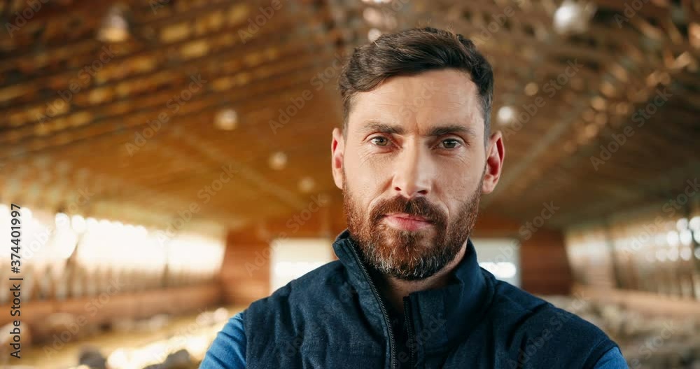 Close up of face of young handsome Caucasian man farmer looking at ...