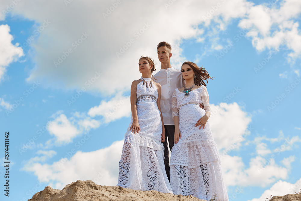 A love triangle, a man posing with two young girls in white dresses ...