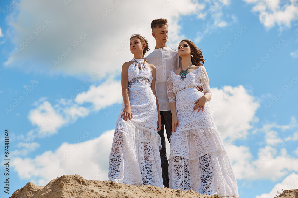 A love triangle, a man posing with two young girls in white dresses ...