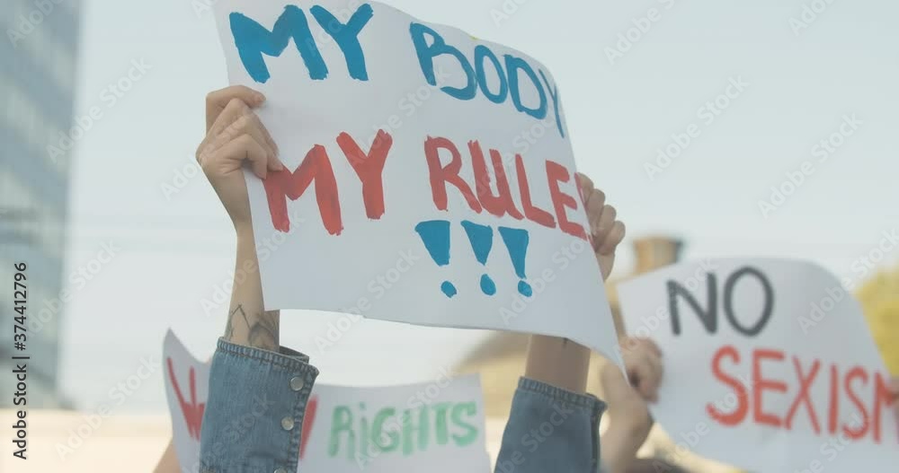 Close-up of My body my rules poster in female Caucasian hands ...