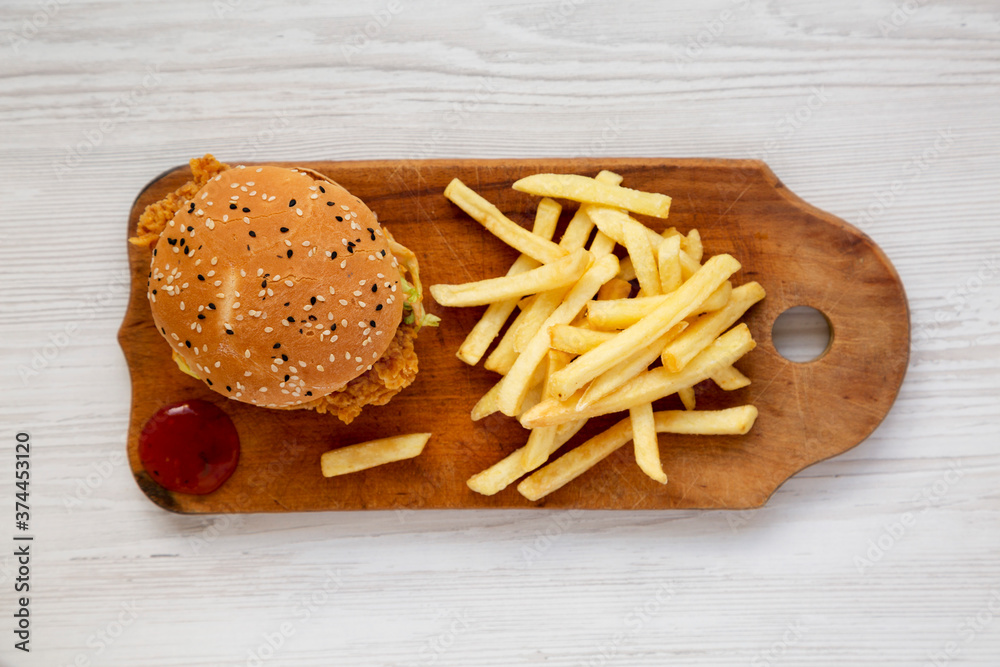 Homemade Chicken Strips Burger with French Fries and sour-sweet sauce ...