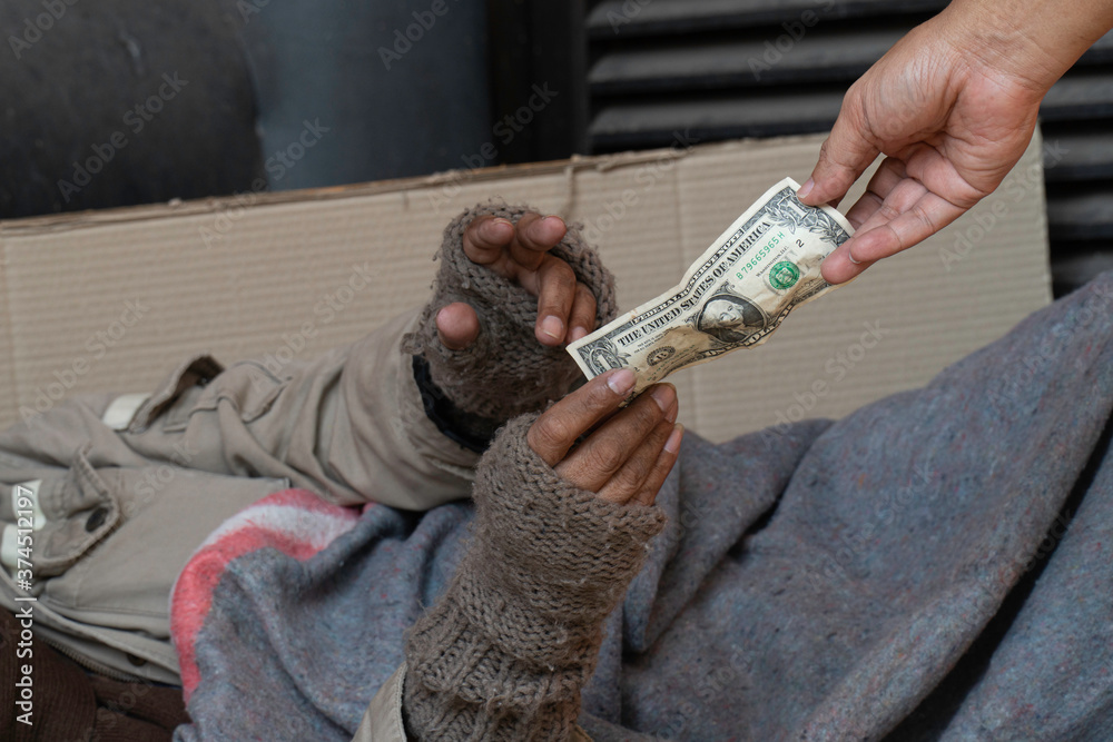 Dollar bill. Man giving one dollar bill to homeless man. Stock Photo ...