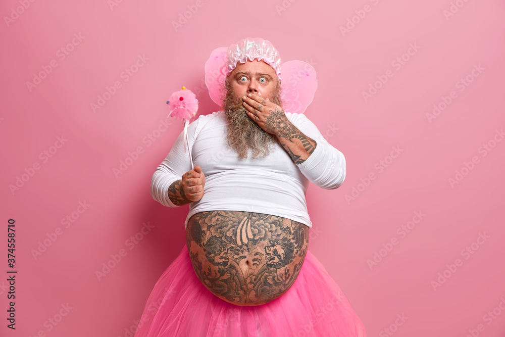 Emotional scared bearded man has fat belly, being scared of something ...