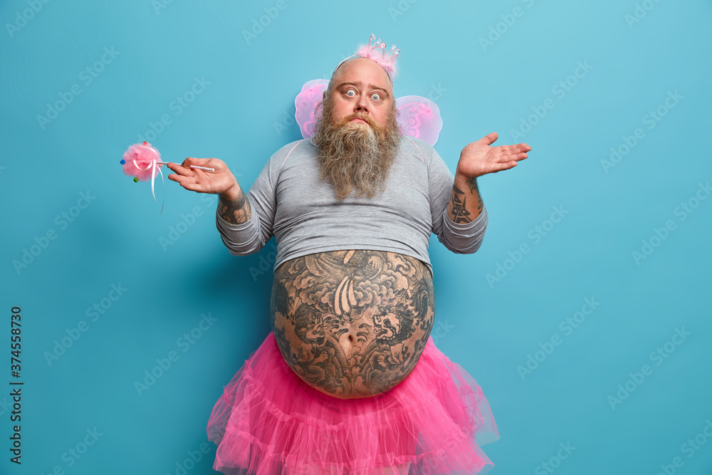 Doubtful unaware bearded fat father has cool costume party at home ...