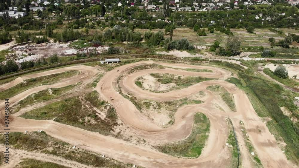 Motorbiker is riding motorbike on extreme sport motorcycle racetrack ...