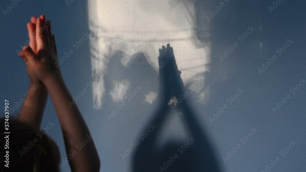 Child claps hands on unfocused foreground and focus to blurry hand ...