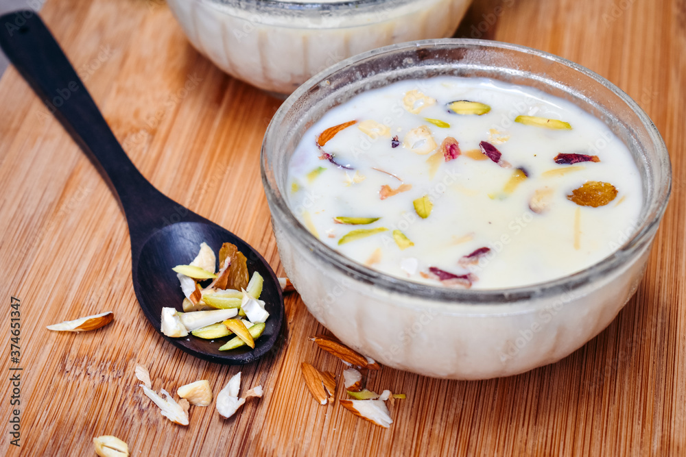 Indian sweet dish popularly known as Kheer or Rice Pudding in bowl on ...