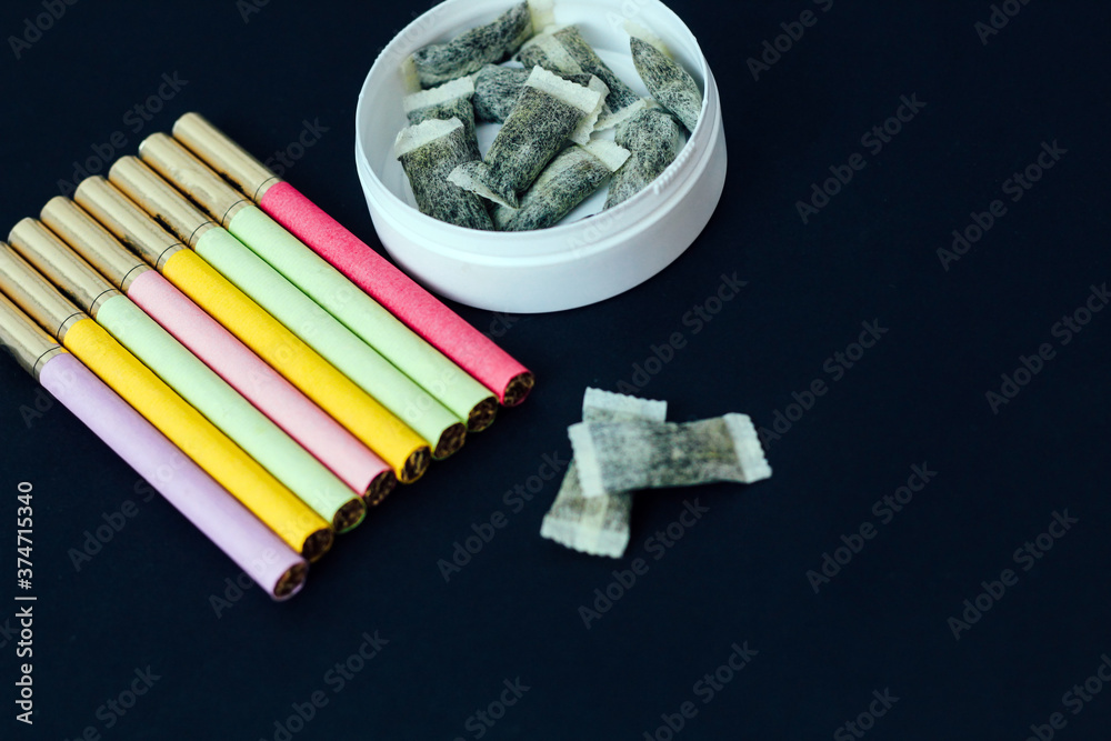Round box of snus with multicolored cigarettes Cigarette substitute ...