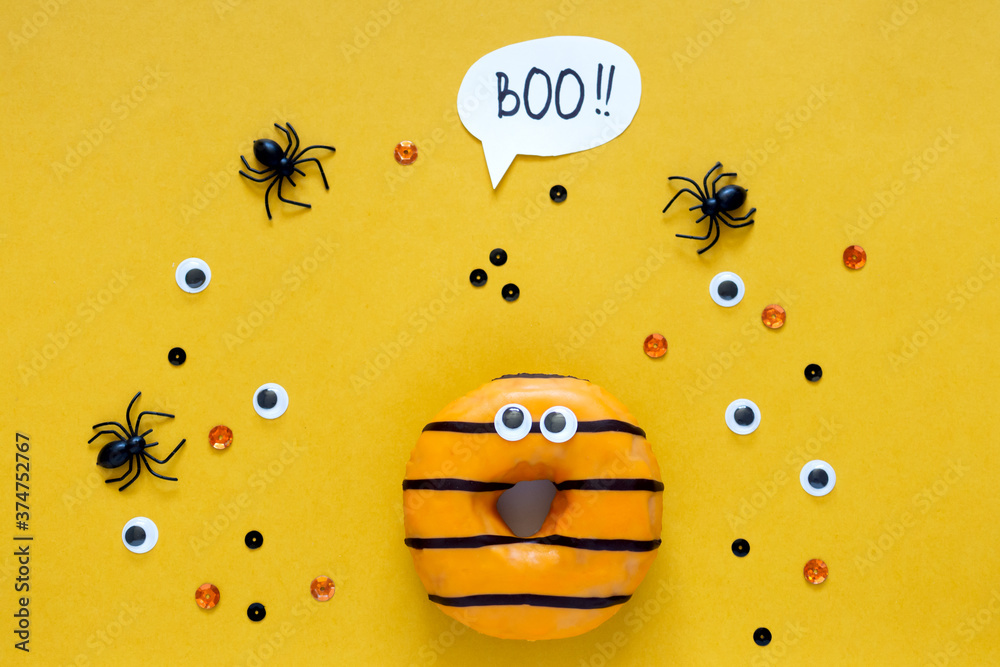 Happy halloween holiday concept. Funny food for kids - scared donuts ...