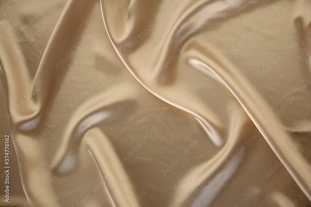 beautiful silk fabric of a delicate cream color draped with small folds ...