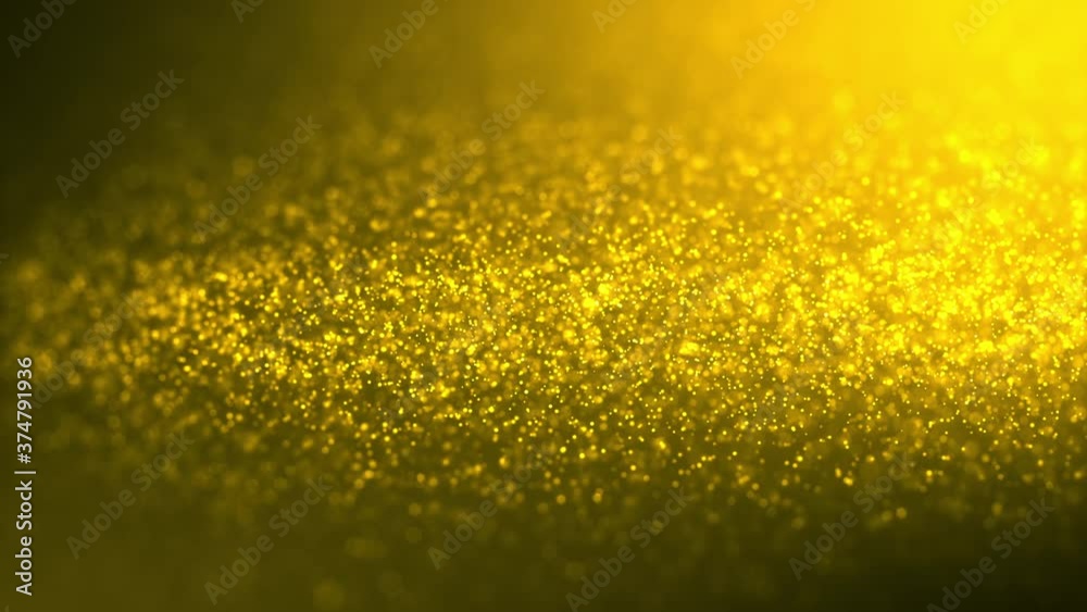 Gold dust particles fly in slow motion in the air lingering slowly ...