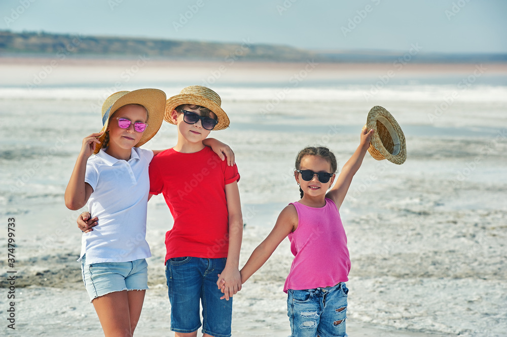 Happy children on vacation at the salt lake, travel nature Park . Green ...