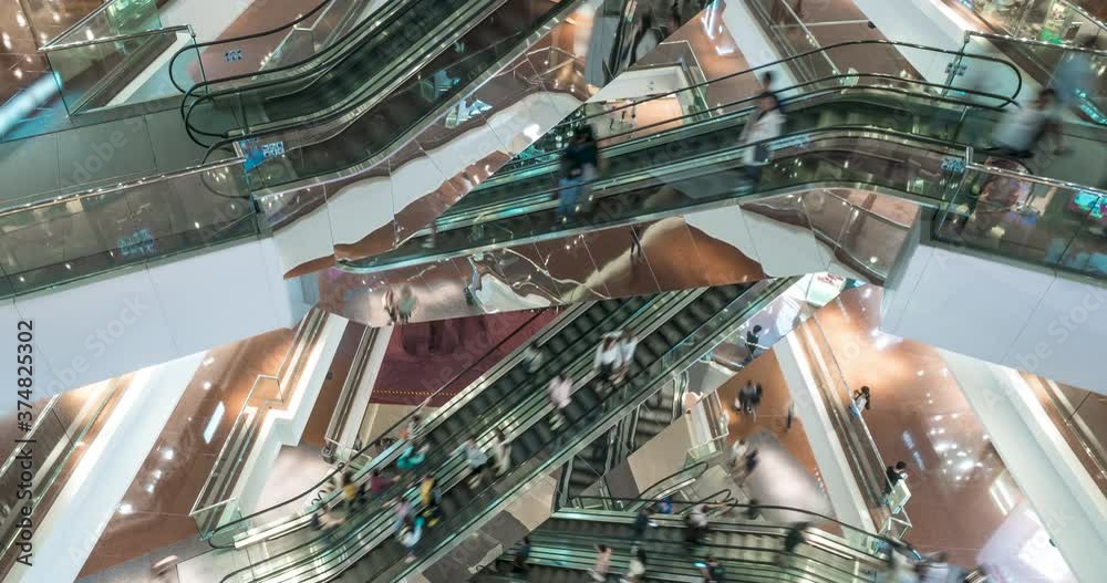 Escalator in modern multi level shopping mall crowd of people. Rush ...