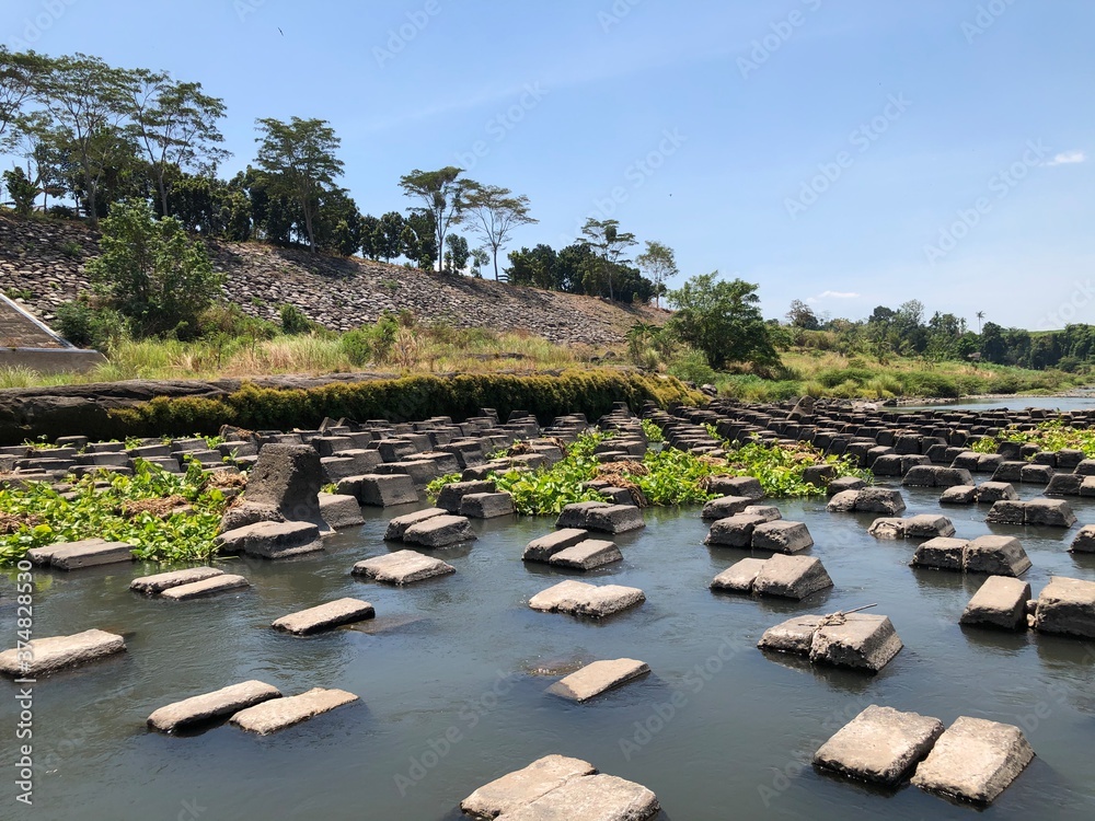 pictures of natural scenery of a river with neatly arranged stone ...
