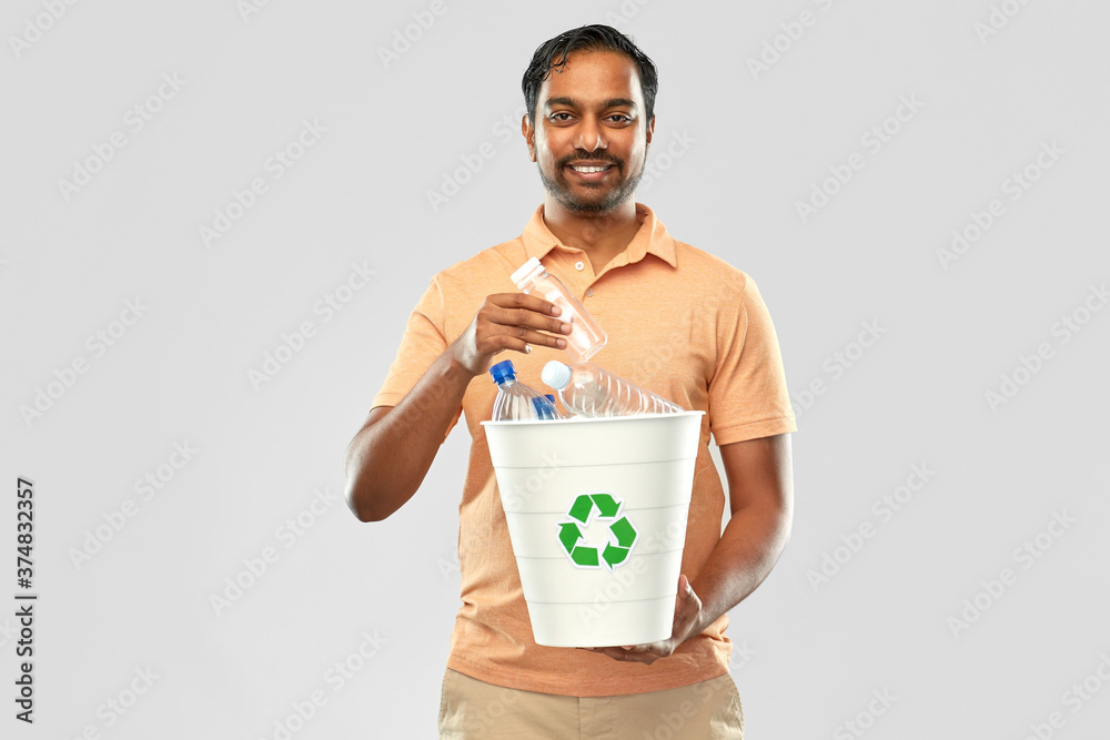 recycling, waste sorting and sustainability concept - smiling young ...