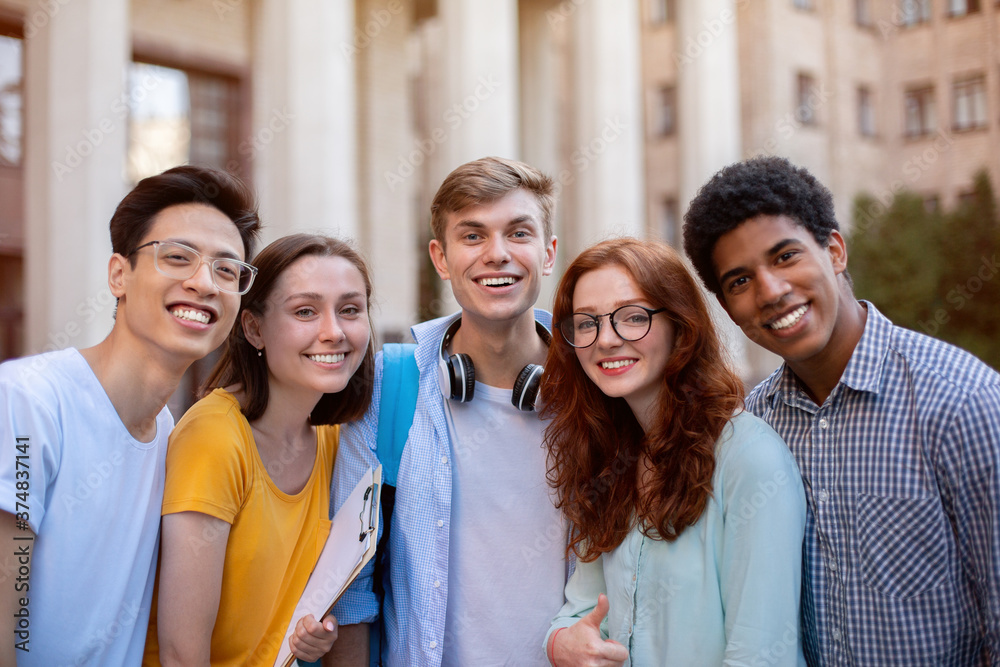 Joyful Multiethnic Students Posing Smiling To Camera Standing Outside ...