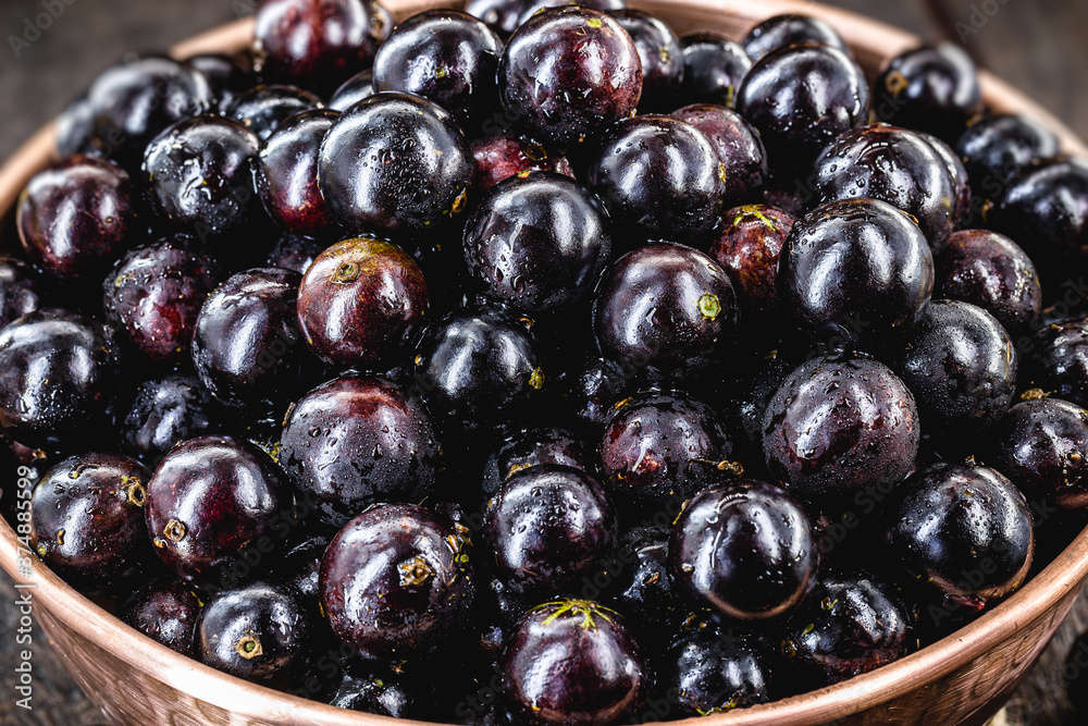 Jabuticaba. Brazilian and South American tropical fruits, in a copper ...