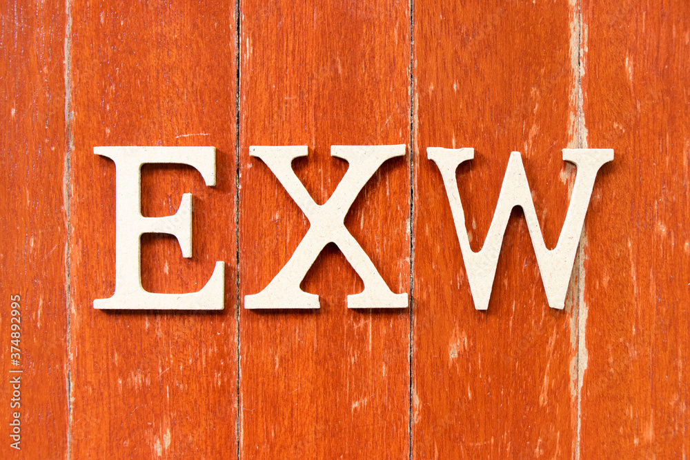 Alphabet letter in word EXW (abbreviation of Ex works) on old red color ...