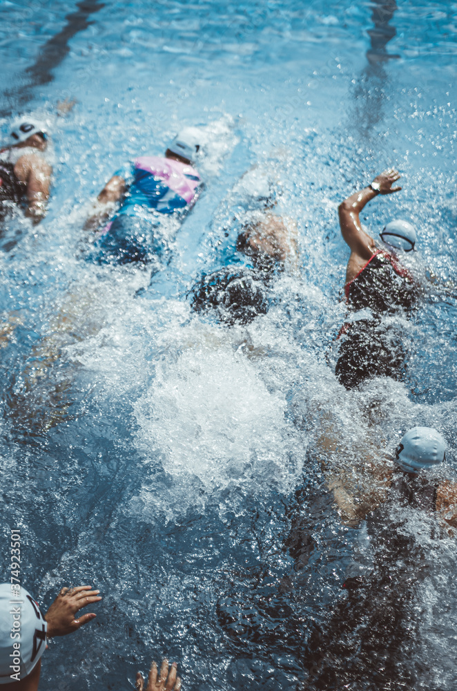 Foto de Triathlon competitors in swim , triathletes in action and ...