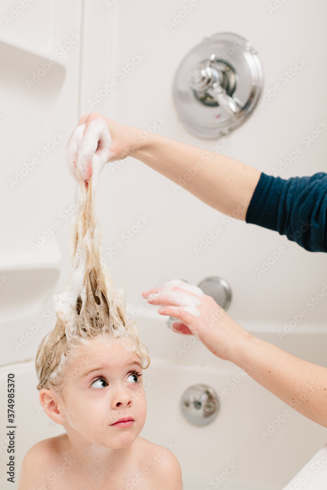 girl washing her hair in bubble bath Stock Photo | Adobe Stock