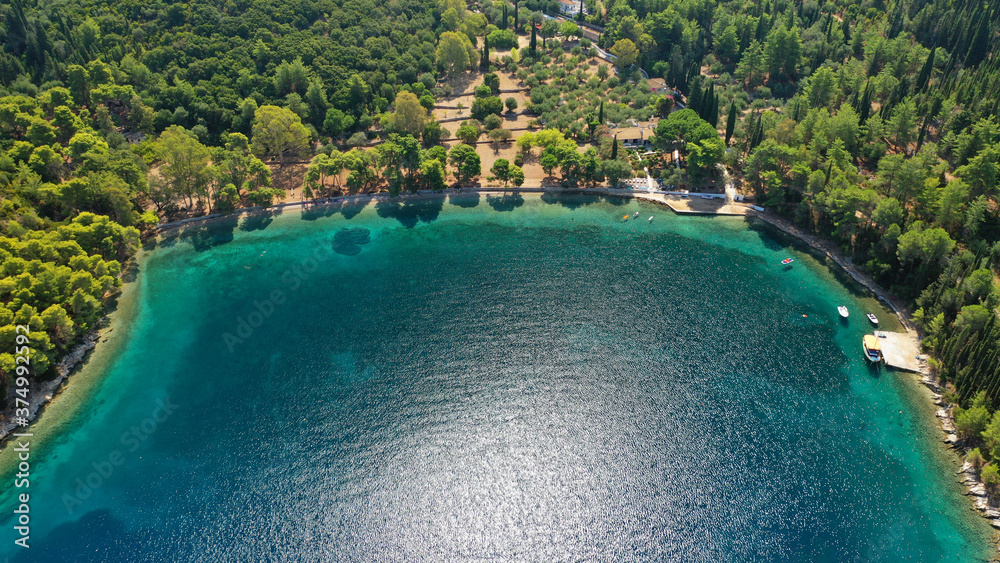 Aerial drone photo of beautiful paradise peninsula and bay of Skinos ...