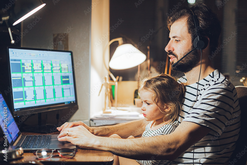 multi-tasking, freelance and fatherhood concept - working father with ...