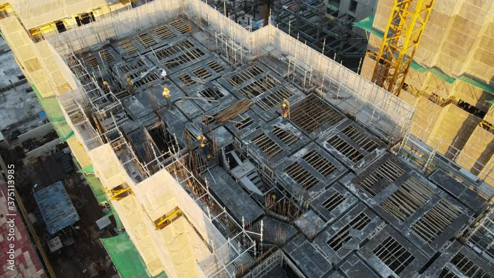 Drone aerial view of the skyscraper building roof in construction in ...