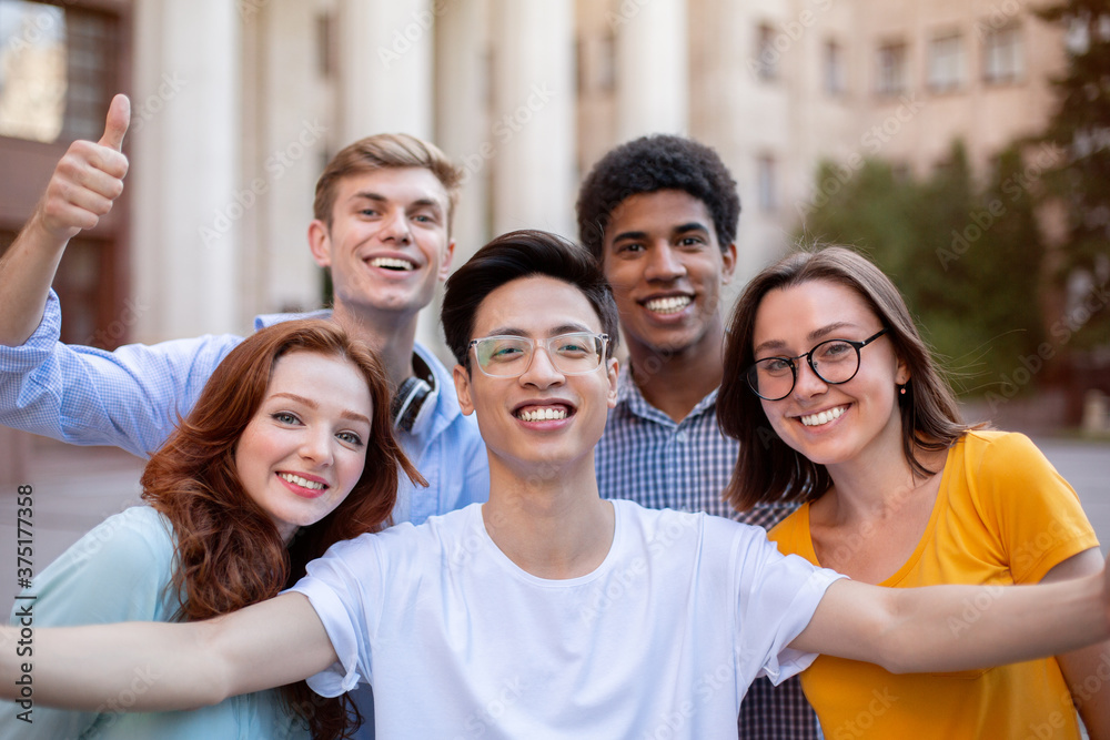 Cheerful Multicultural Students Posing Together Making Selfie Near ...