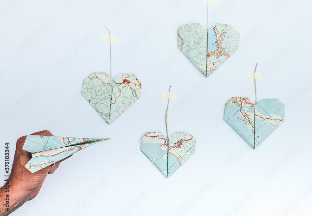 Travel concept: Origami plane with origami heart destinations Stock ...
